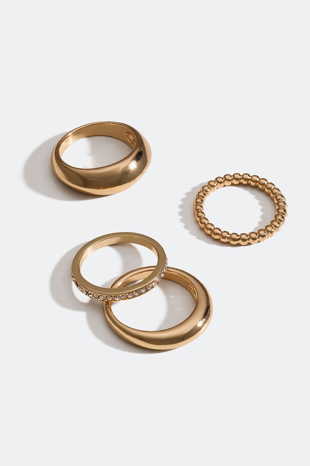 Køb Guldfarvede Ringe I Glat Og Mønstret Design 4 Pak På Glitterdk